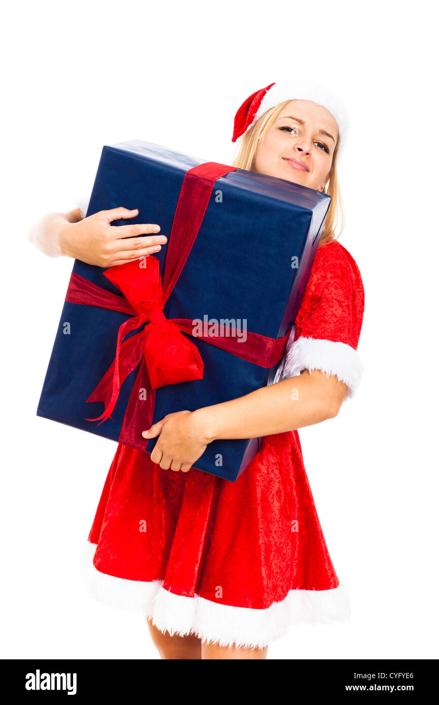 Greedy woman in Santa costume hugging big blue Christmas gift box ...