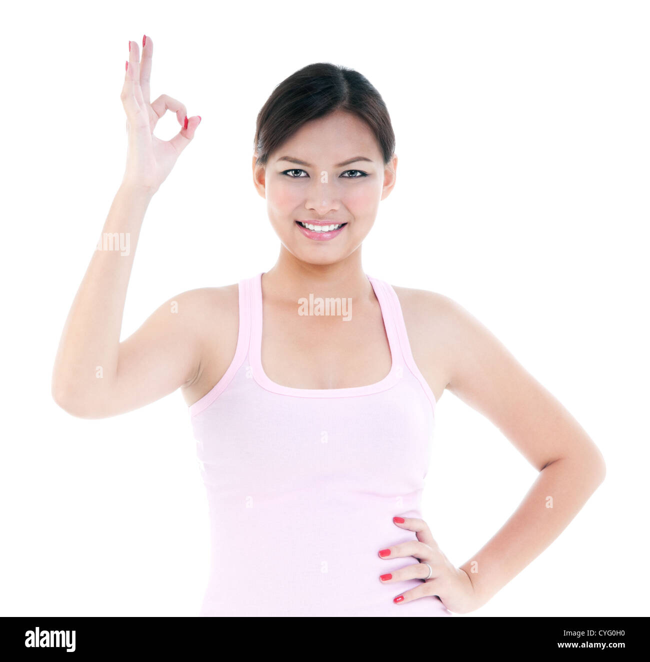 Beautiful young woman giving OK hand gesture, portrait Stock Photo - Alamy