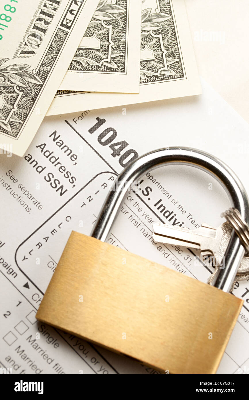 Tax form, dollars and key lock Stock Photo - Alamy