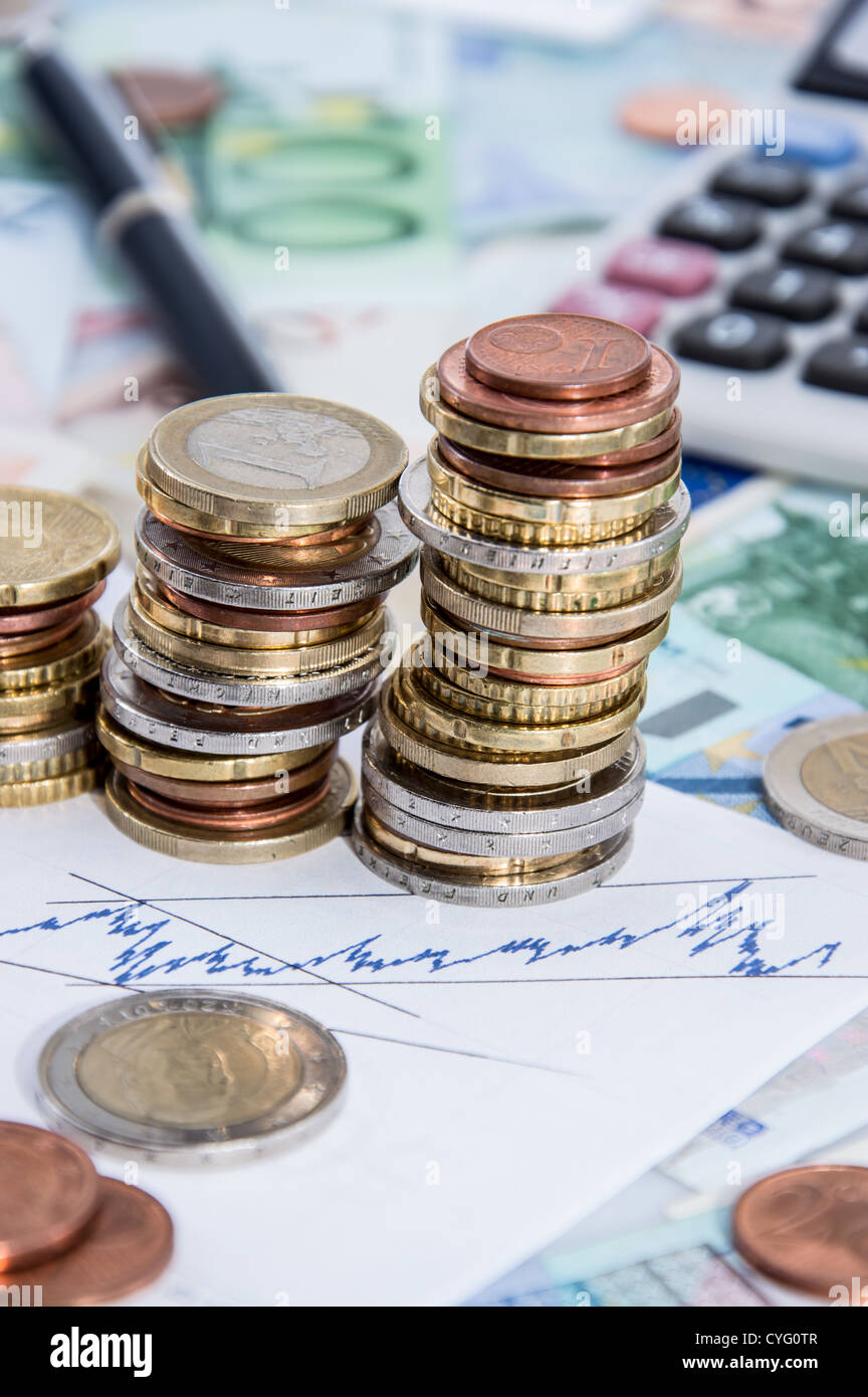 Money Stacks with Calculator on Bills Stock Photo - Alamy