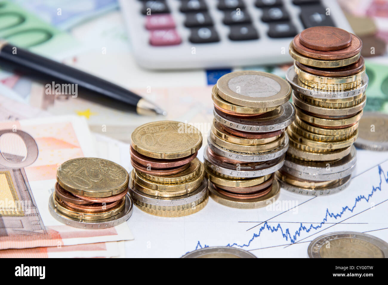 Stacked Money Towers on Bills Stock Photo - Alamy