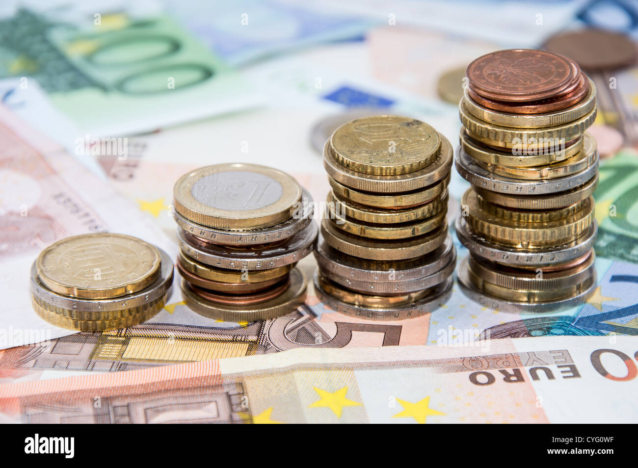 Stacked Money Towers on Bills Stock Photo - Alamy