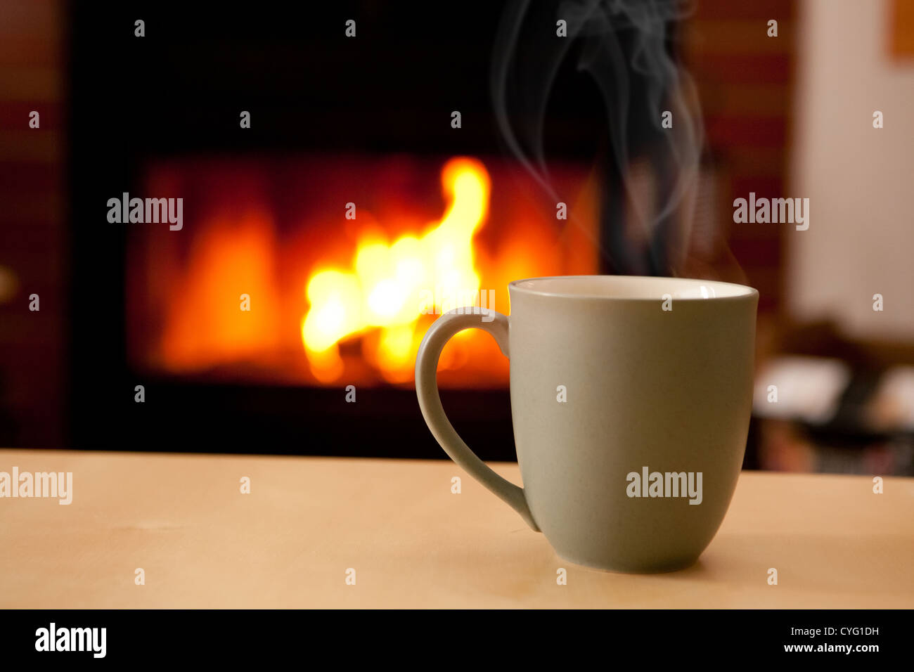 A roaring fire and hot cup of coffee Stock Photo - Alamy