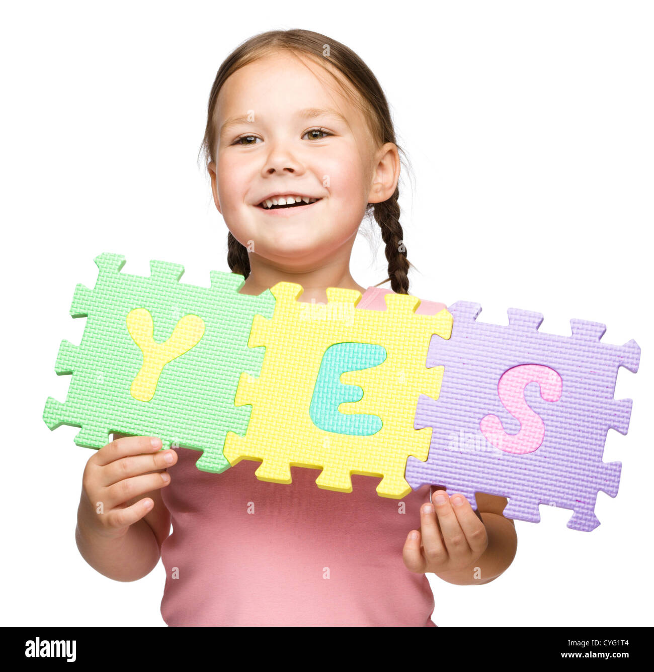 Cute little girl is holding Yes slogan, isolated over white Stock Photo ...