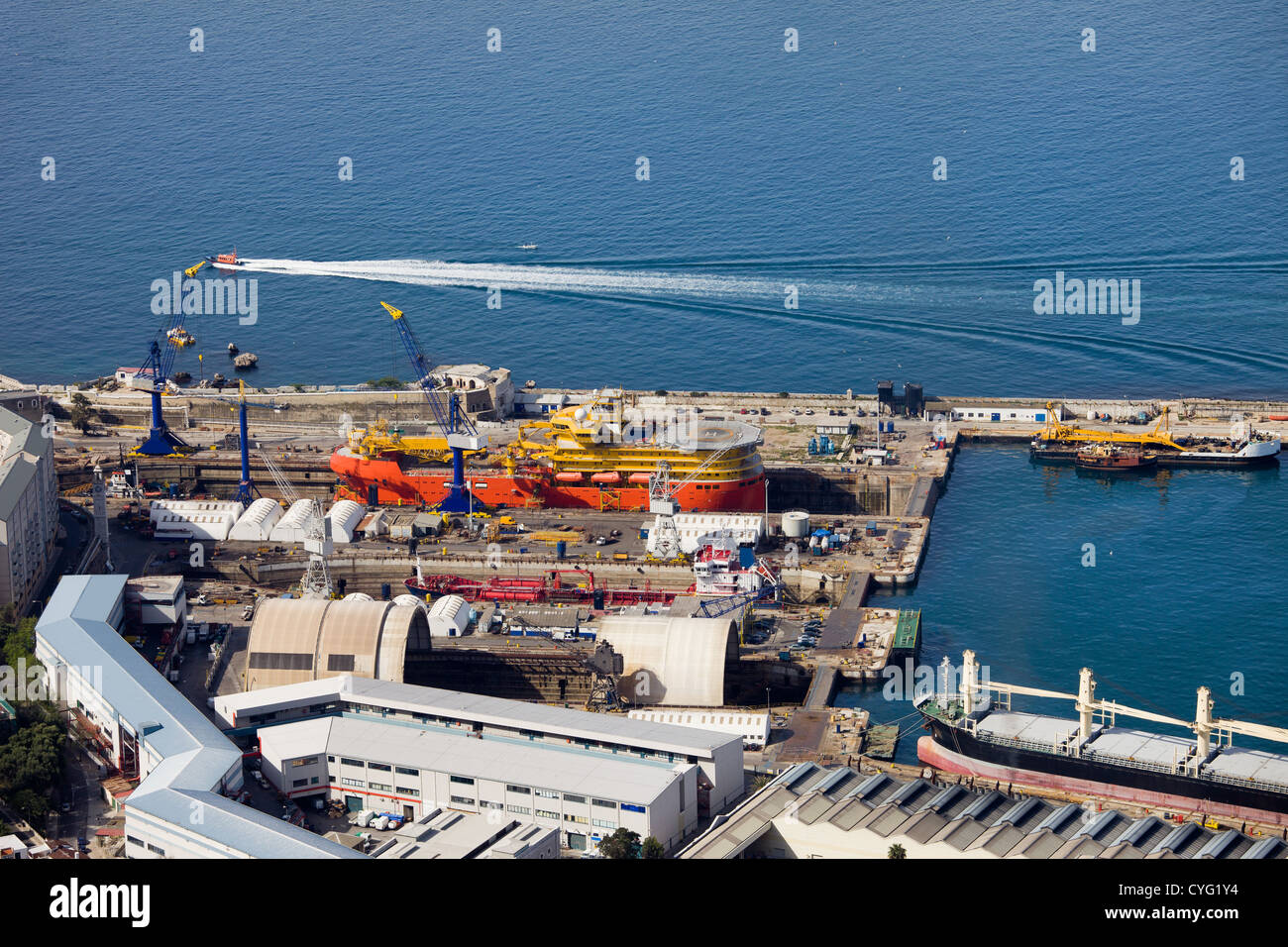 View from the Rock of Gibraltar on shipyard docks built in late 19th ...