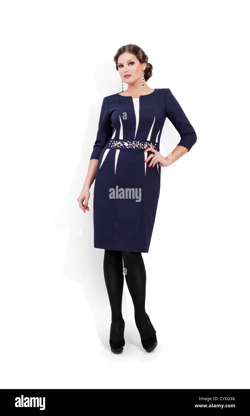 Beautiful woman in black business dress standing next to white ...