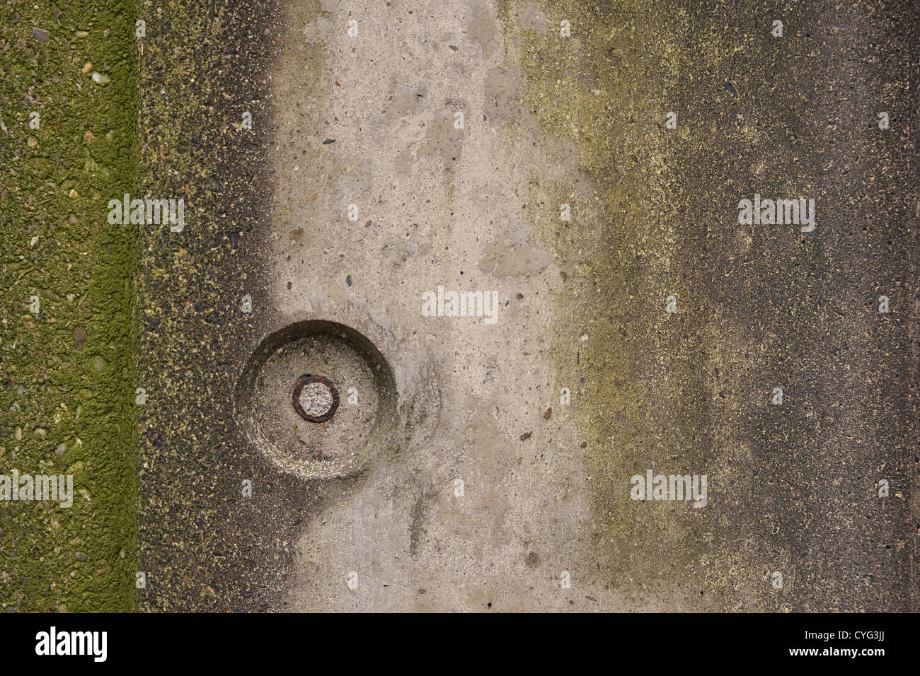 weathered cement on side of building showing mold and stains from rain ...