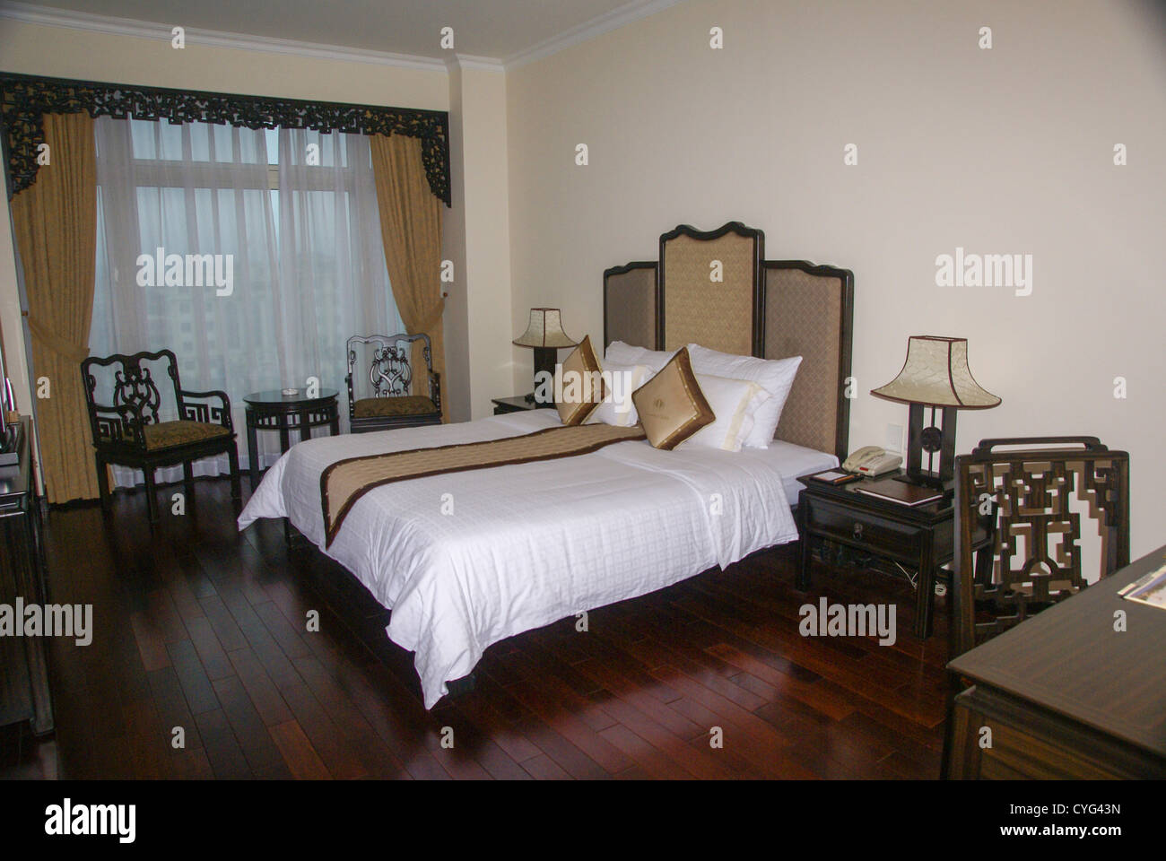 Vietnam, Hue, Interior of the Imperial Hotel Bedroom Stock Photo - Alamy