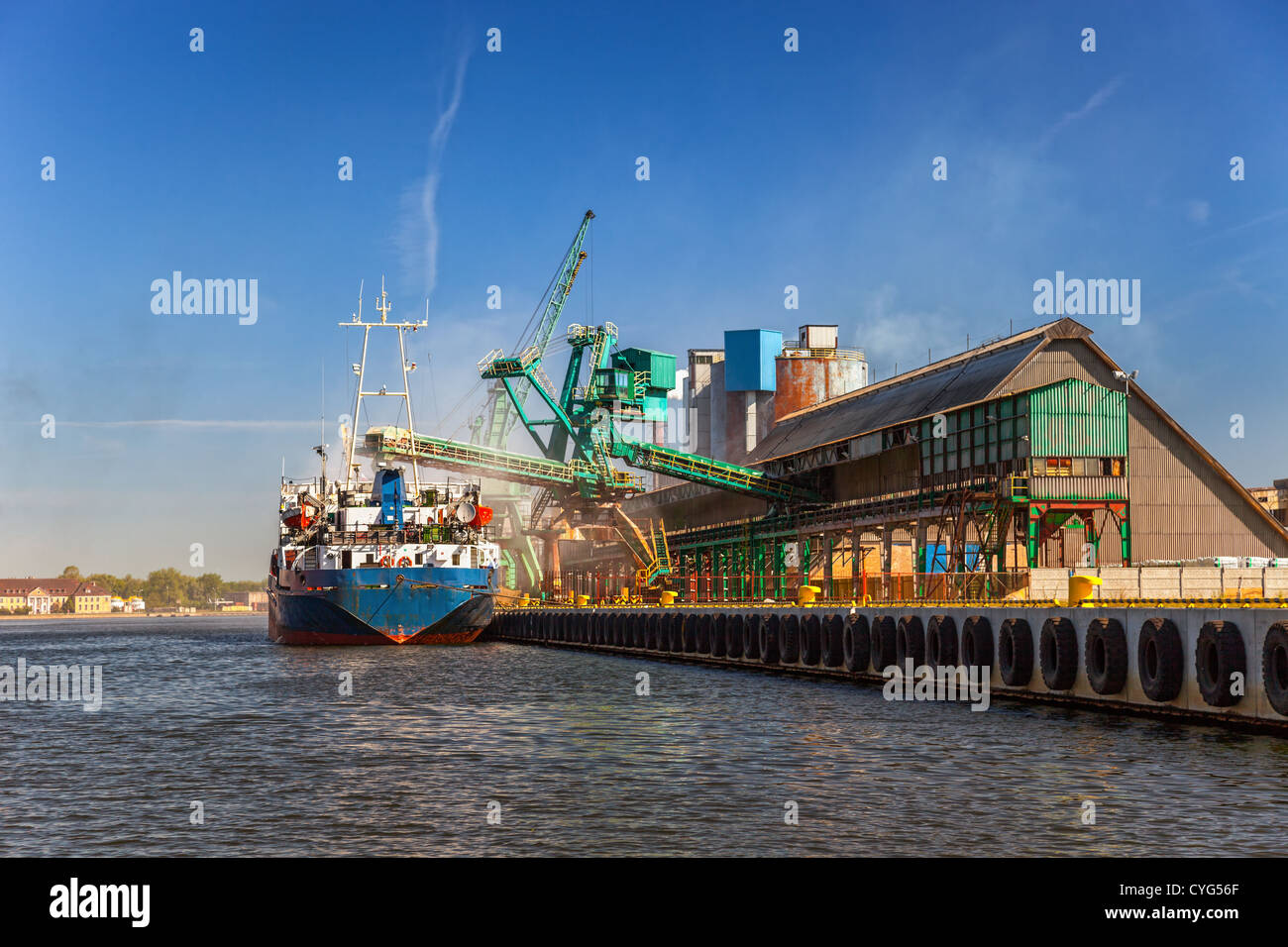 Cargo ship loading on the dock in port of Gdansk, Poland Stock Photo ...