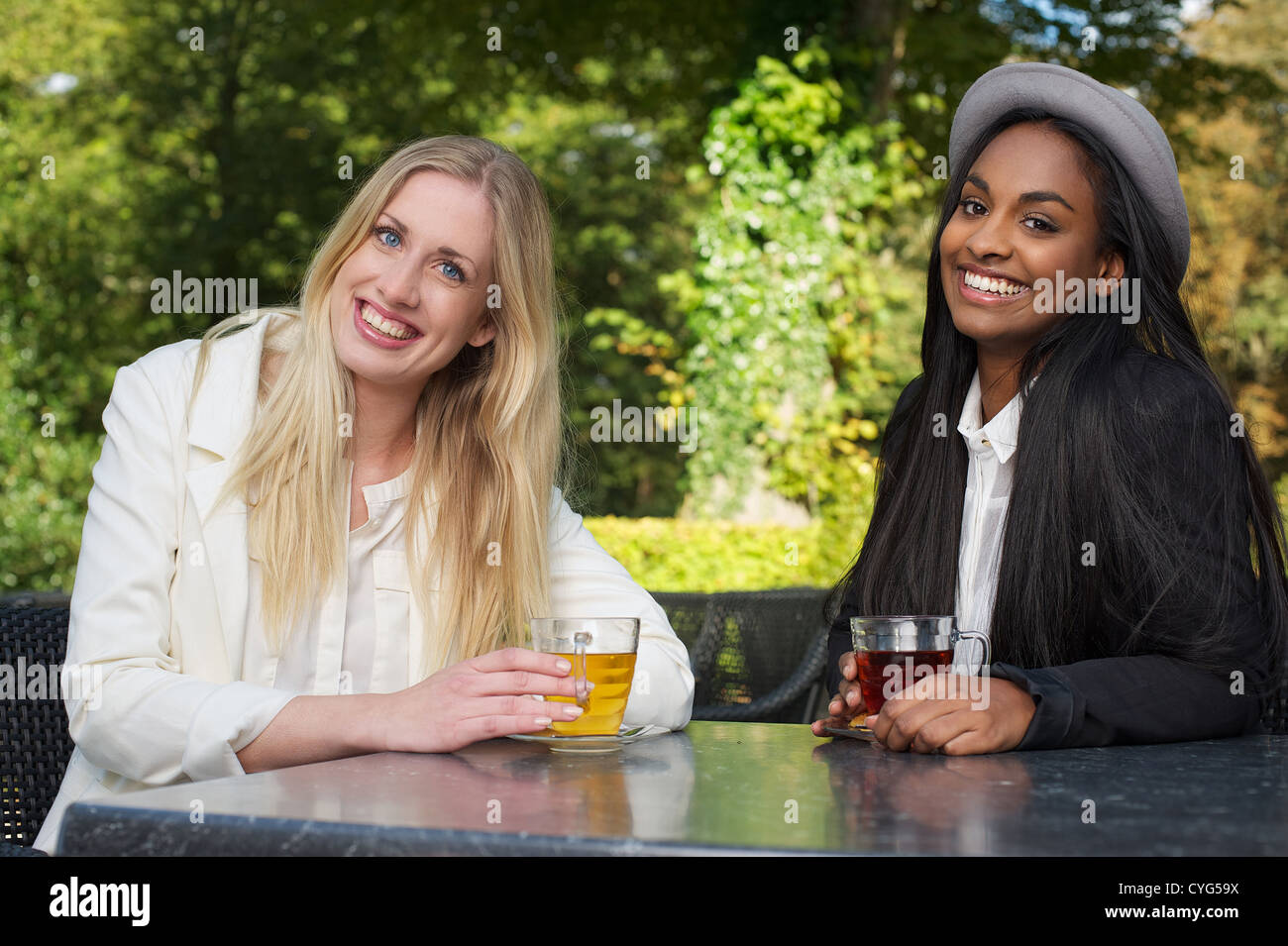 Friends Drinking Tea at an outdoor restaurant Stock Photo - Alamy