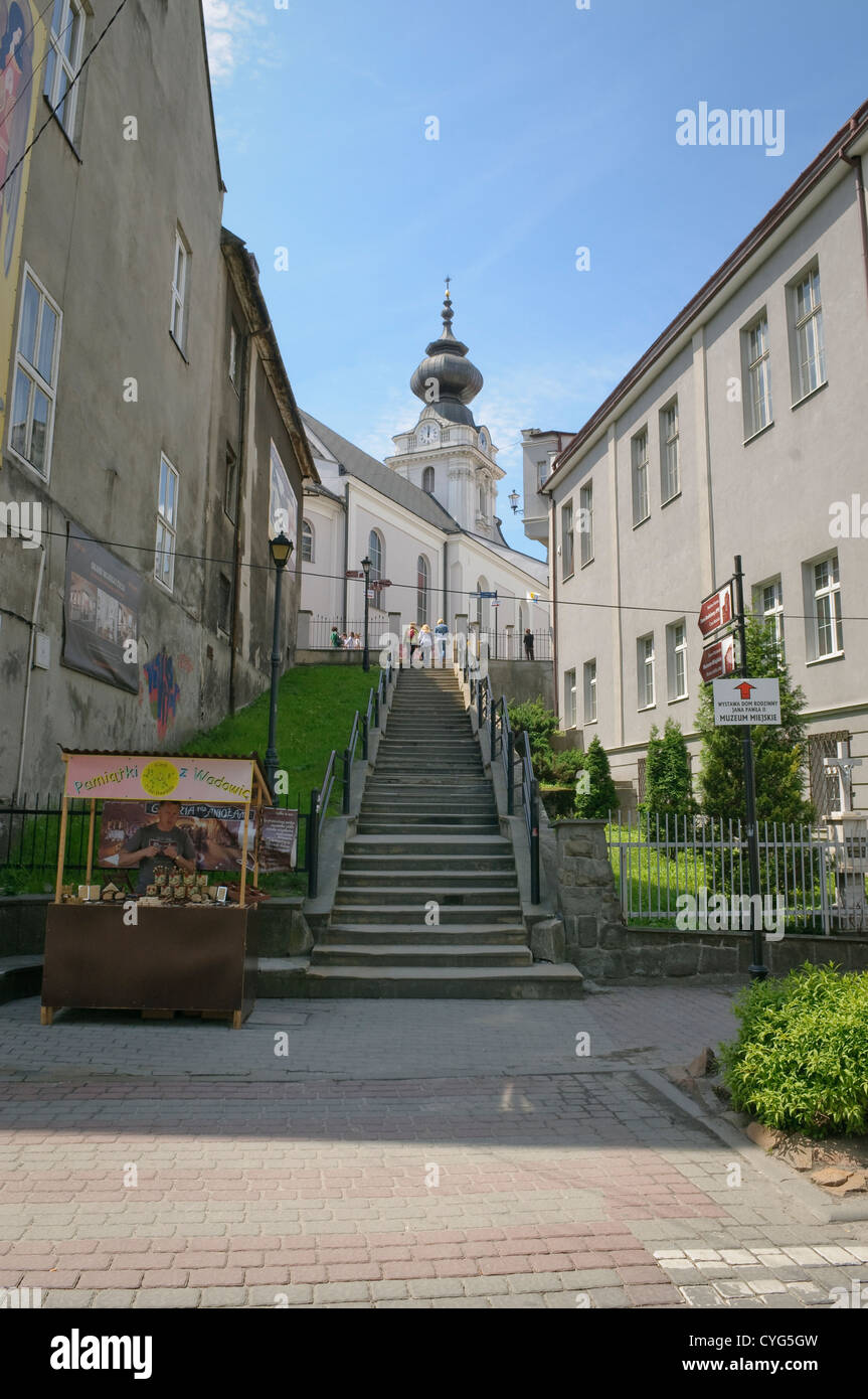 Souvenir stall next to stairway leading to church, Wadowice, Poland ...