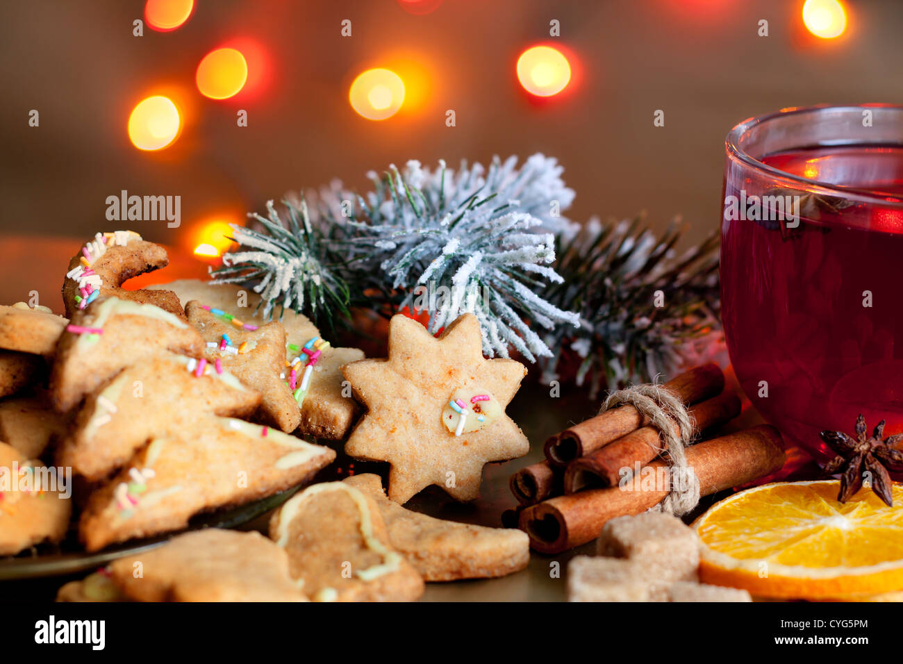 Christmas homemade cookies with punch and spices on colorful blurred ...