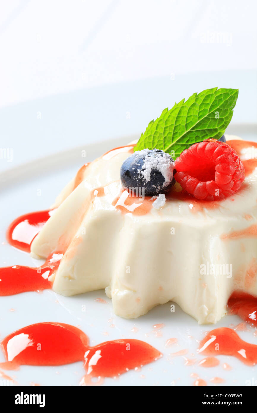 Panna cotta with fruit coulis and wild berries Stock Photo - Alamy