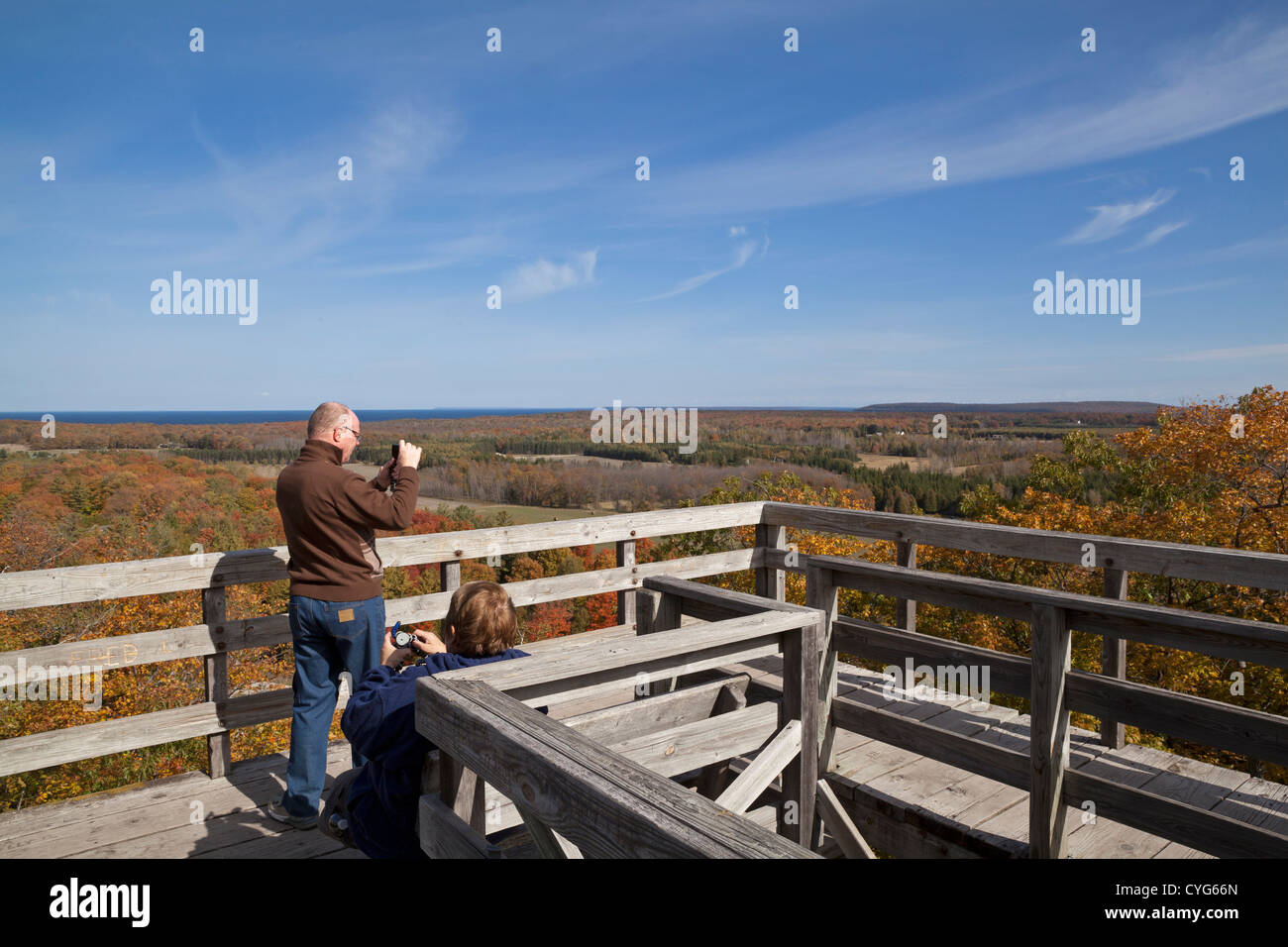 A photographer captures fall images on the lookout tower on Washington ...