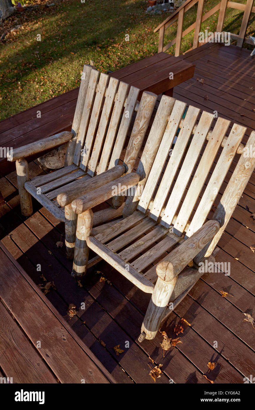 Two empty rocking chairs sit side by side on a deck Stock Photo - Alamy
