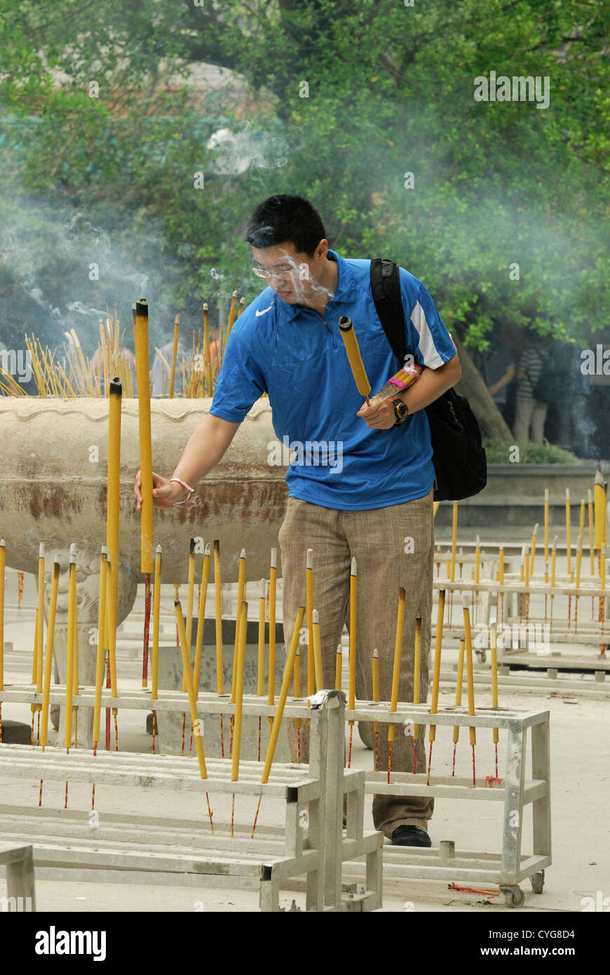 Buddhist ritual of Incense offerings at the entrance of Po LIn ...