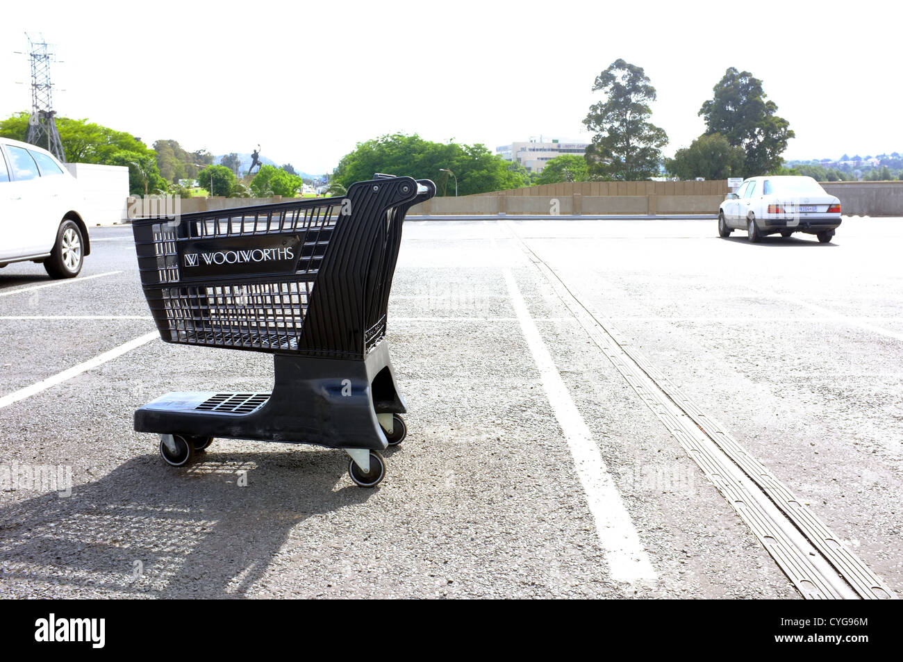 A Woolworths shopping trolley sitting in a car park Stock Photo - Alamy