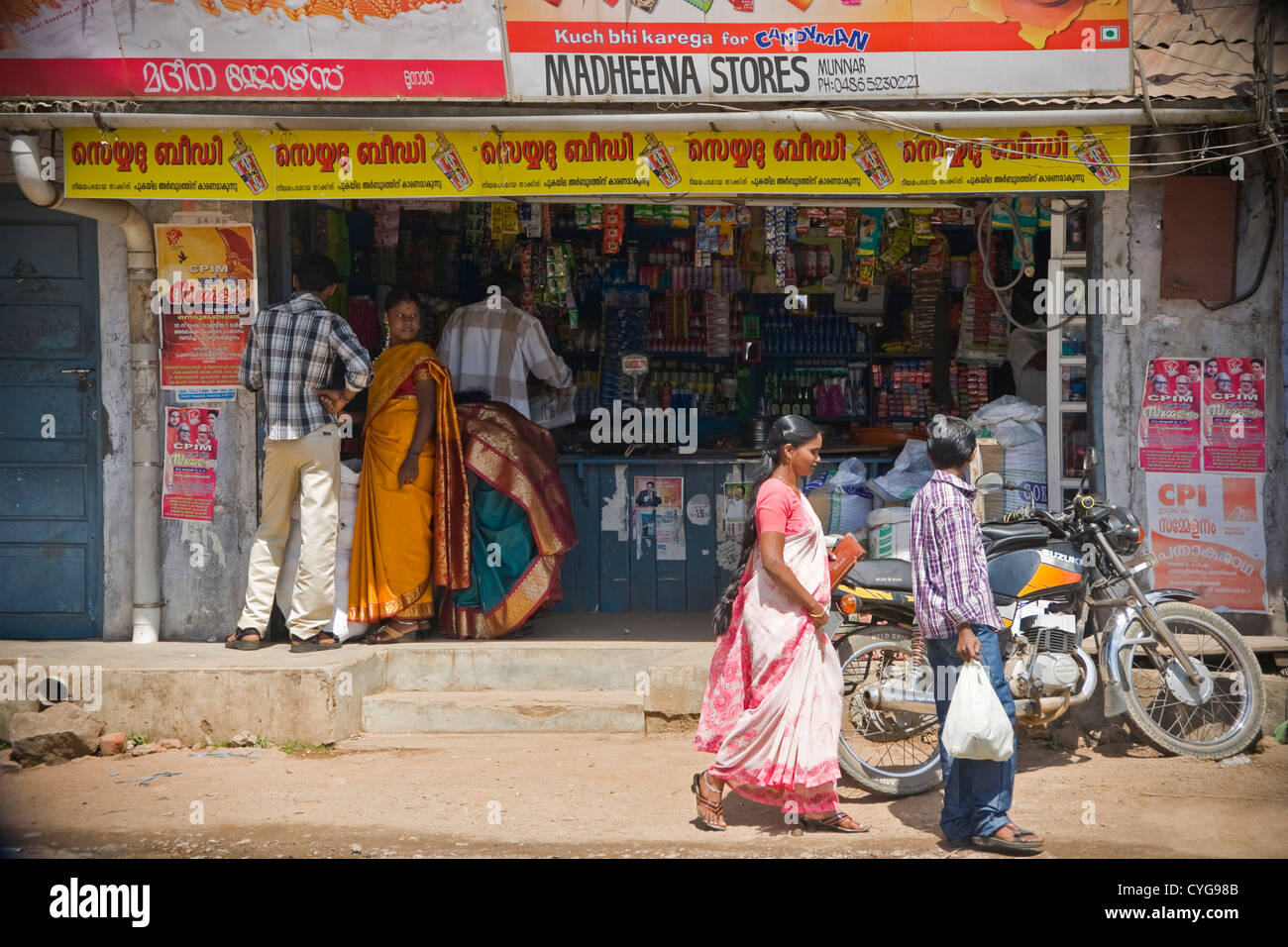 Horizontal view of a typical roadside shop with customers in a street ...