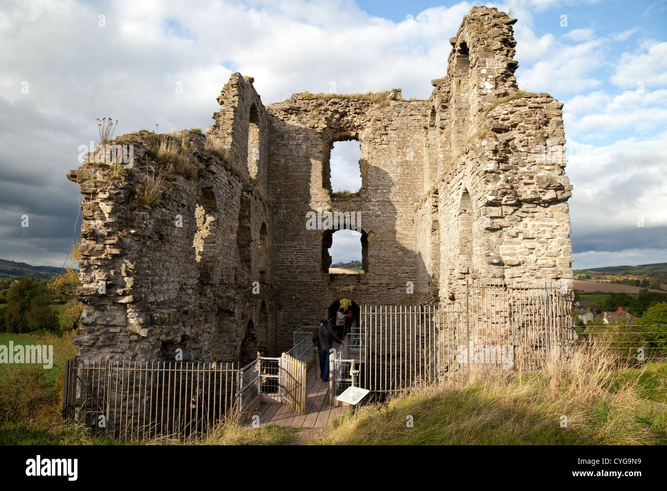 people looking at the Great Tower, the ruins of 11th century Clun ...