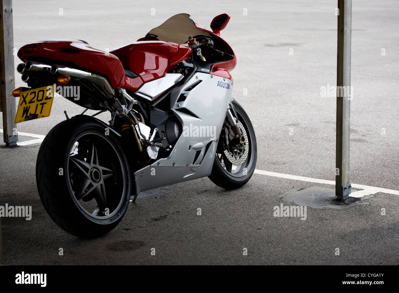 The rear of superbike with four exhausts Stock Photo - Alamy