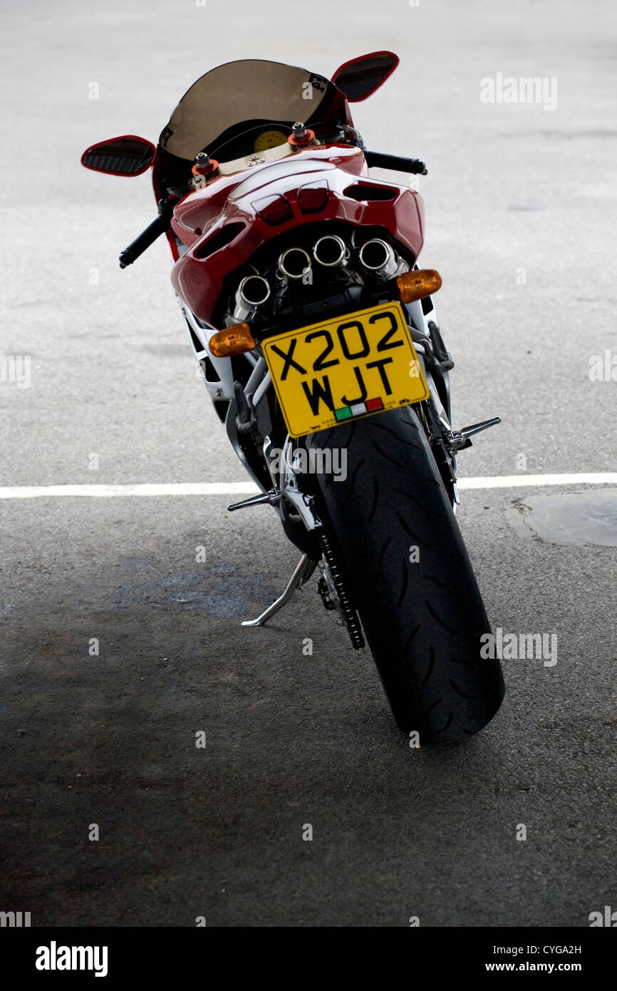 The rear of superbike with four exhausts Stock Photo - Alamy