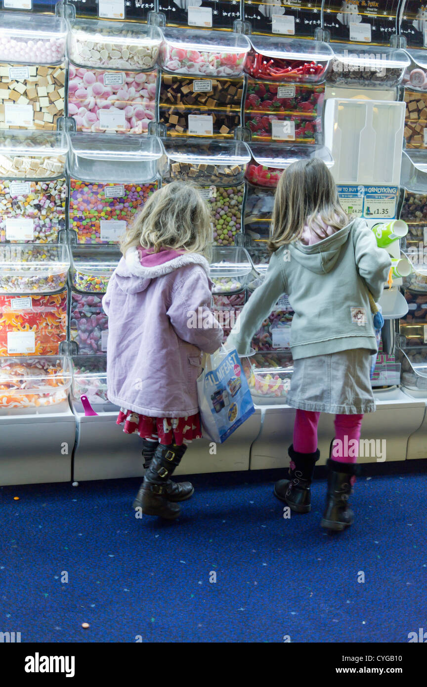 Children looking at pick and mix sweets display at a cinema complex ...