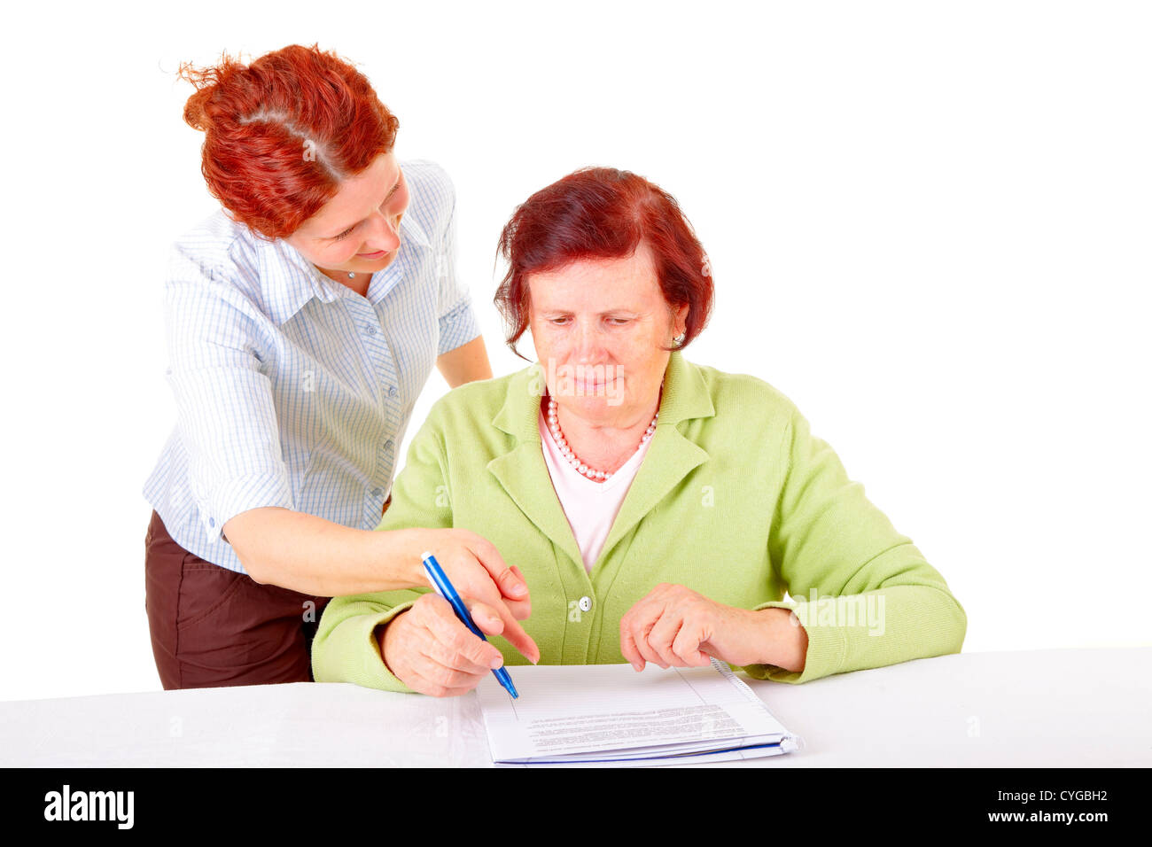 Two women writing a letter Stock Photo - Alamy