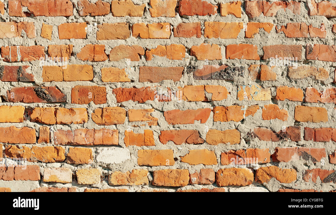 Aged brick construction wall Stock Photo - Alamy