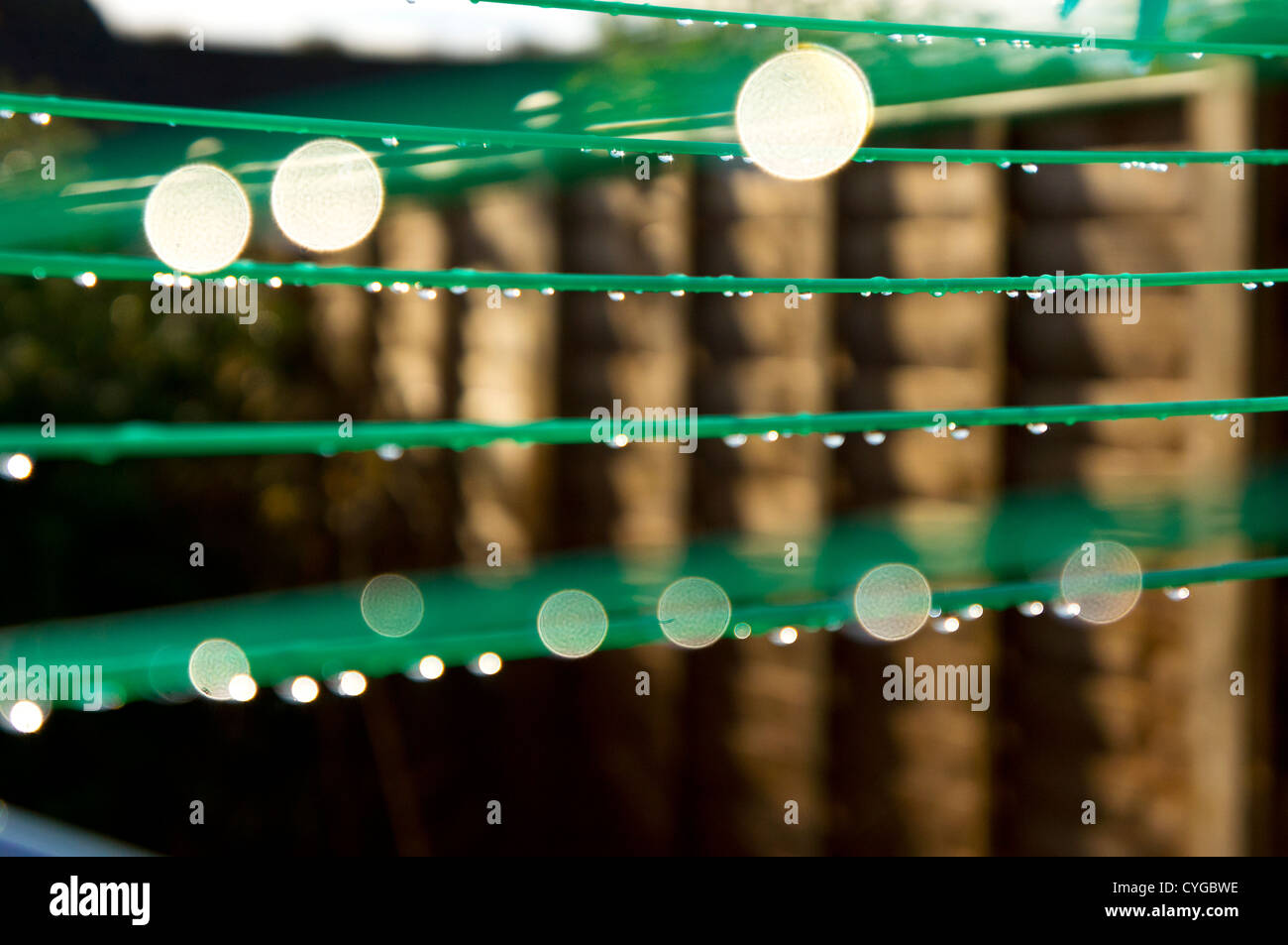 An abstract view of a rotary washing line in a suburban garden with ...