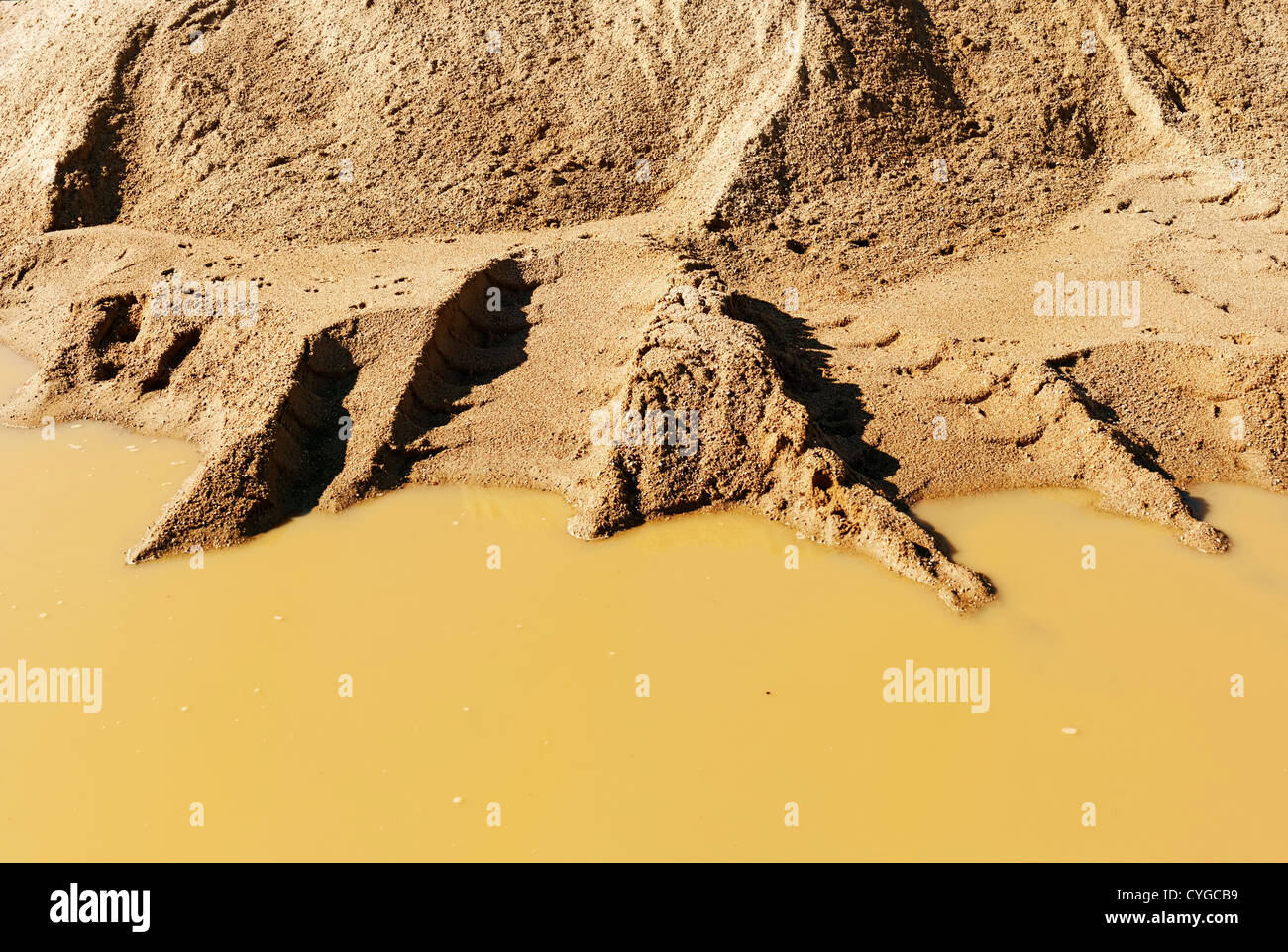 Background from construction sand and muddy water Stock Photo - Alamy