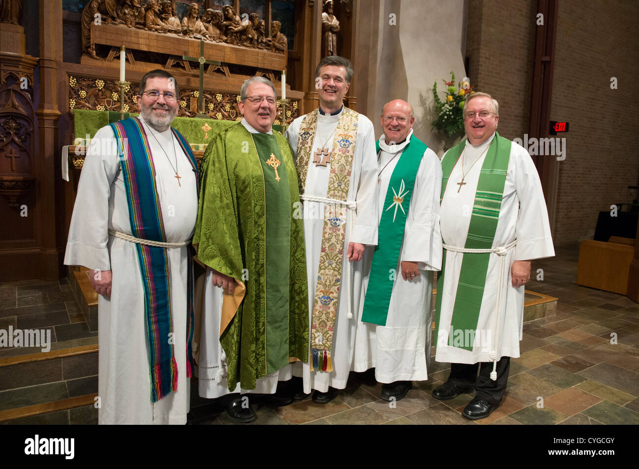 Pastor friends surround Rev. Peder Sandager (in green) during his ...