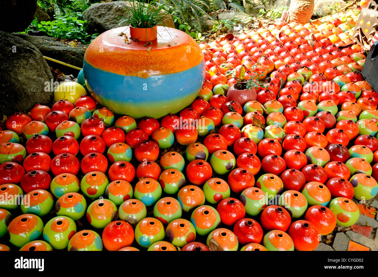 one big colourful pot amongst a thousand smaller colourful pots , Tao ...