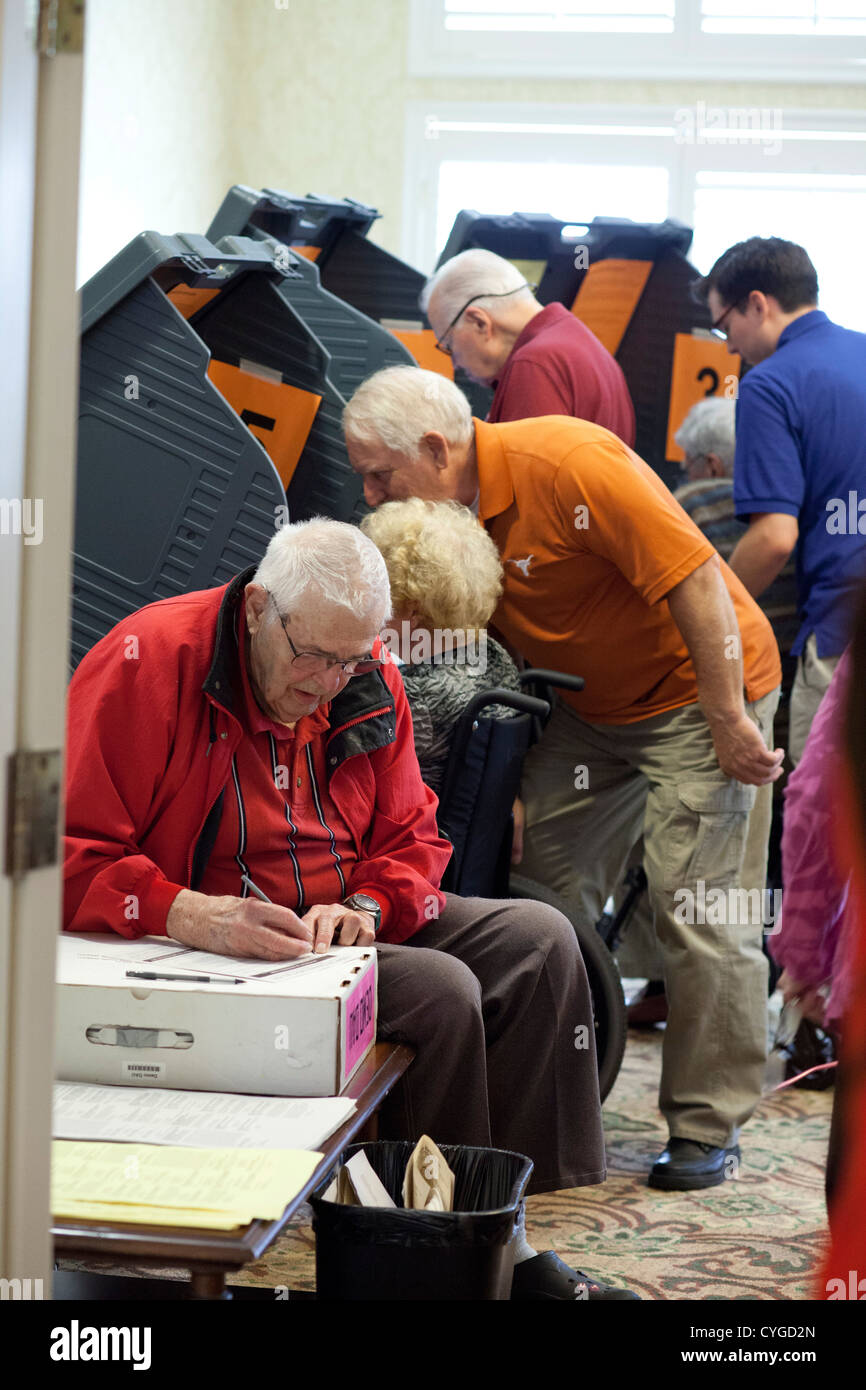 Senior citizens participate in early voting at an assisted living ...