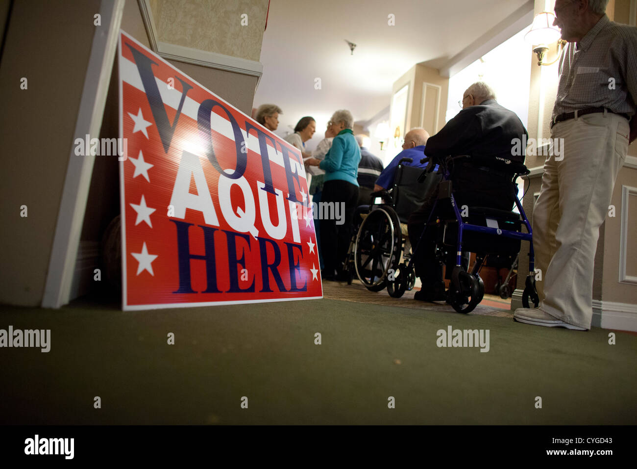 Senior citizens participate in early voting at an assisted living ...