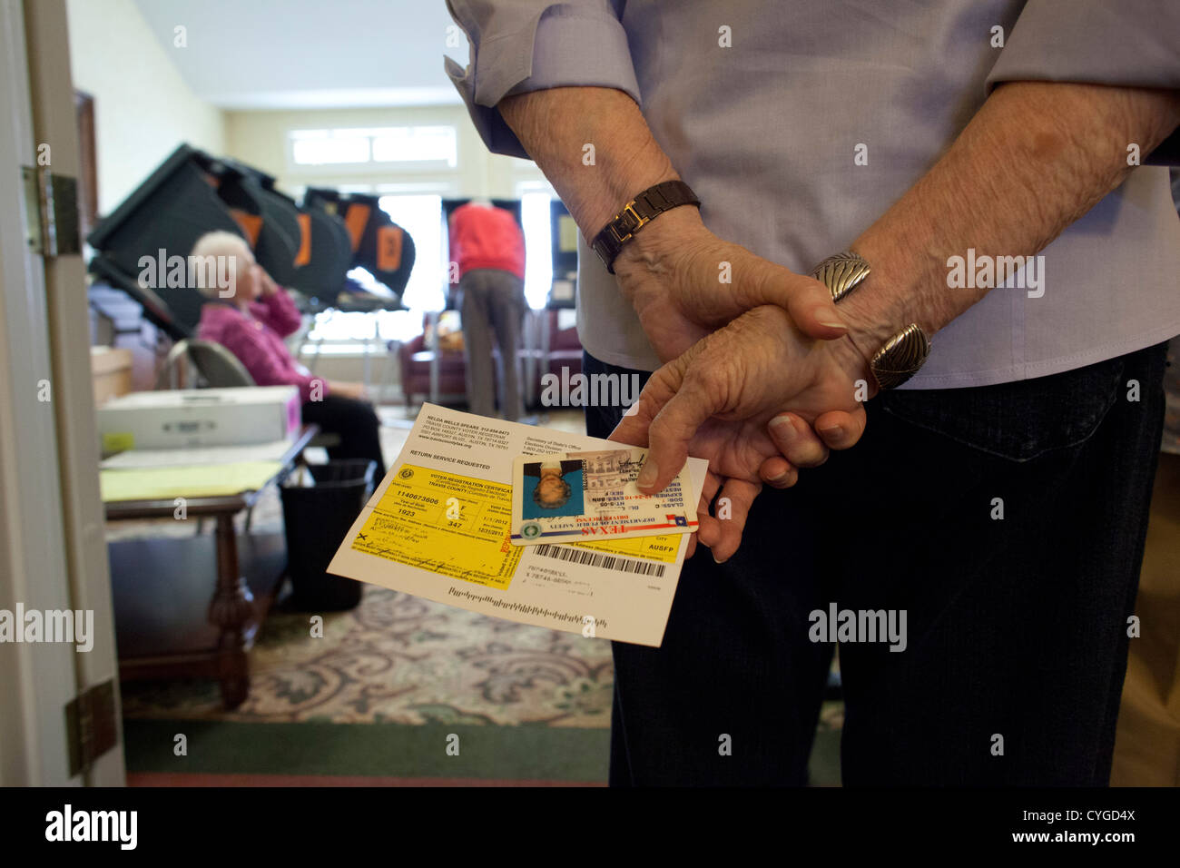 Senior citizens participate in early voting at an assisted living ...