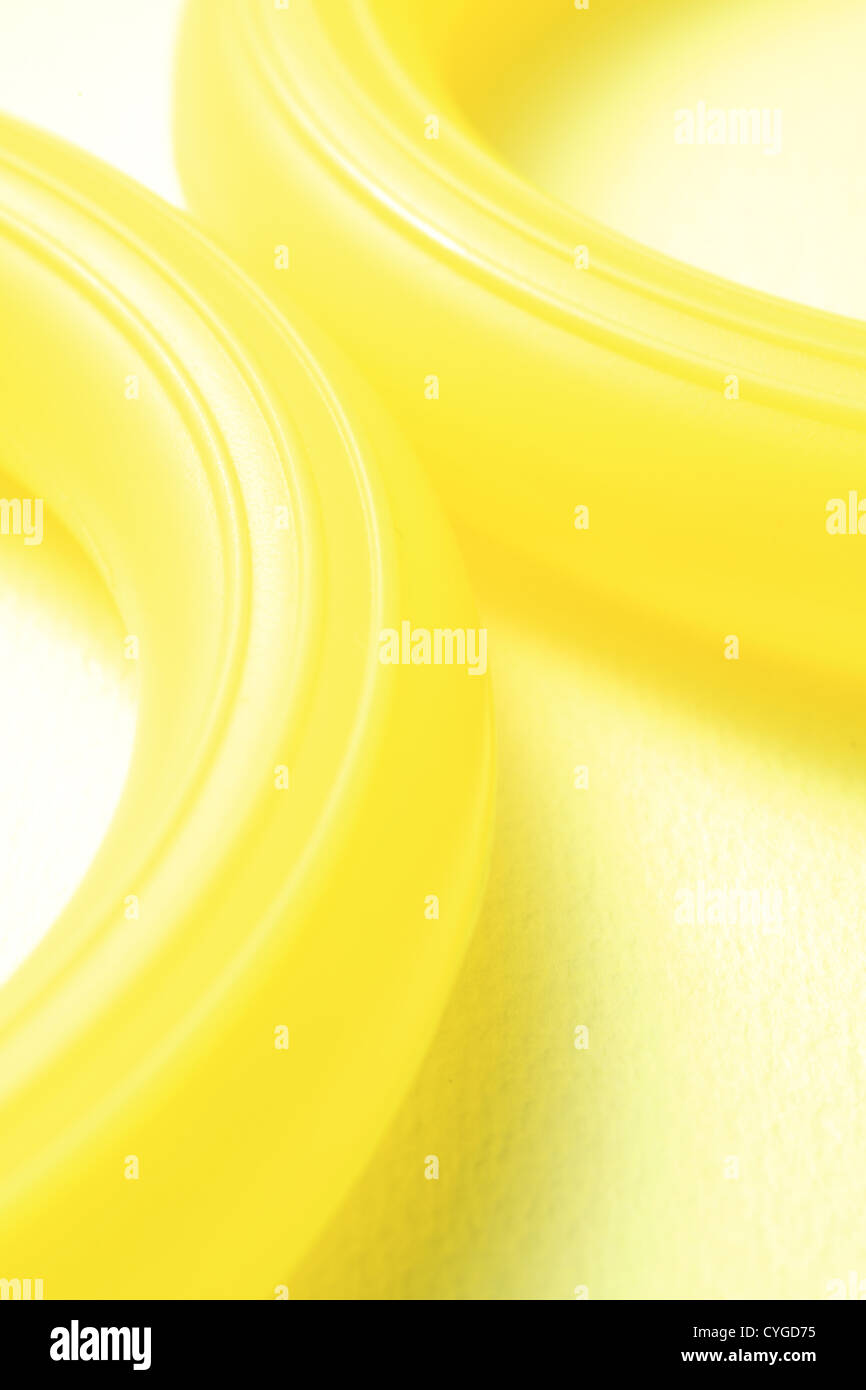 Two yellow rings on yellow background Stock Photo - Alamy