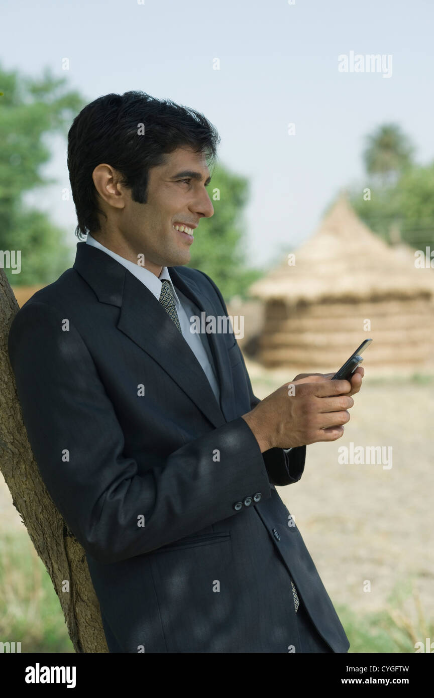 Rural village indian man using mobile phone hi-res stock photography ...