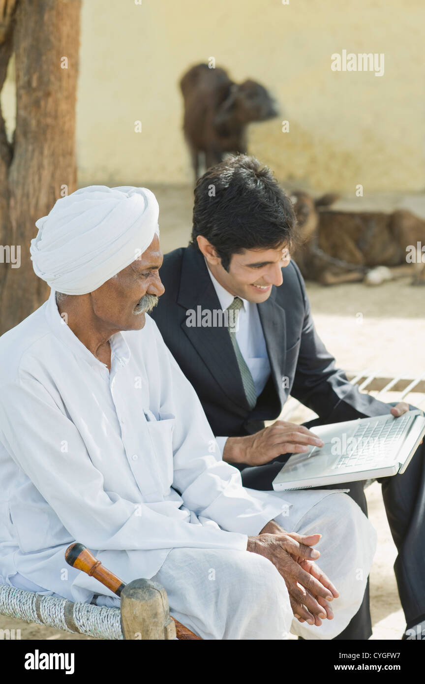 Financial advisor explaining to a farmer about agriculture loan Stock ...