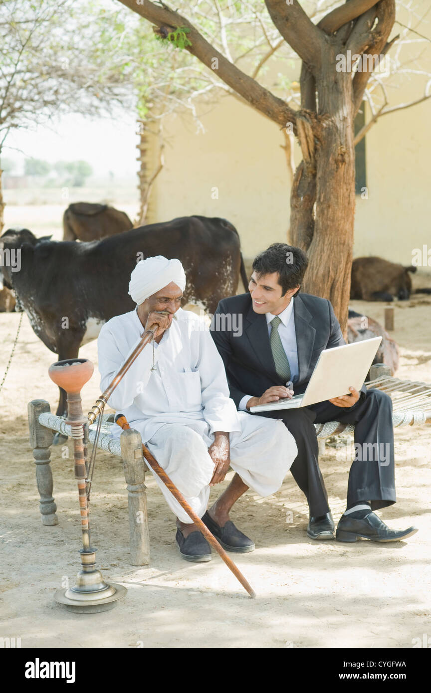 Financial advisor explaining to a farmer about agriculture loan Stock ...
