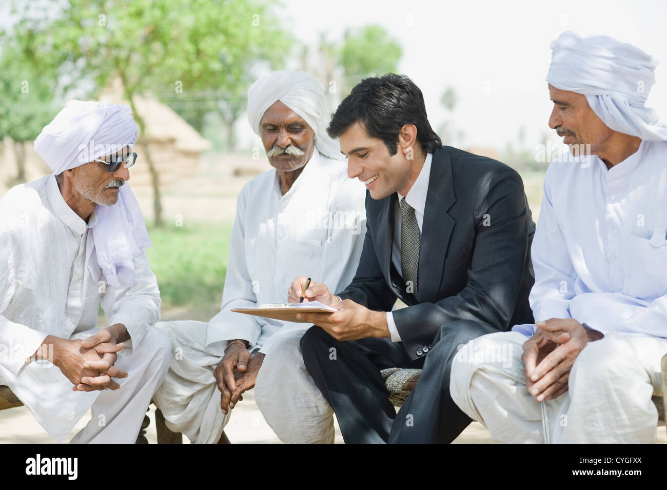 Financial advisor explaining to farmers about agriculture loan Stock ...