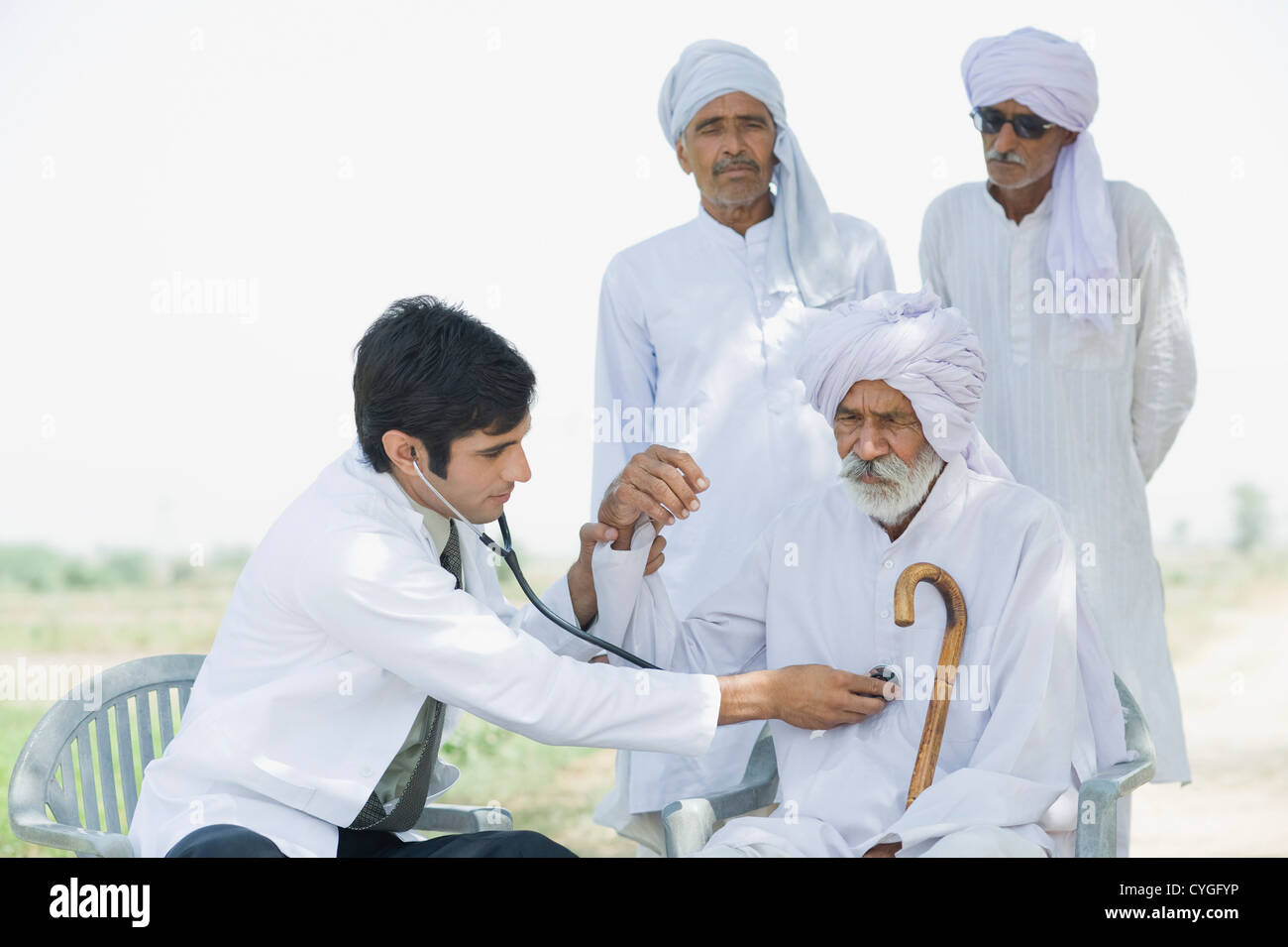 Doctor examining farmer stethoscope hi-res stock photography and images ...