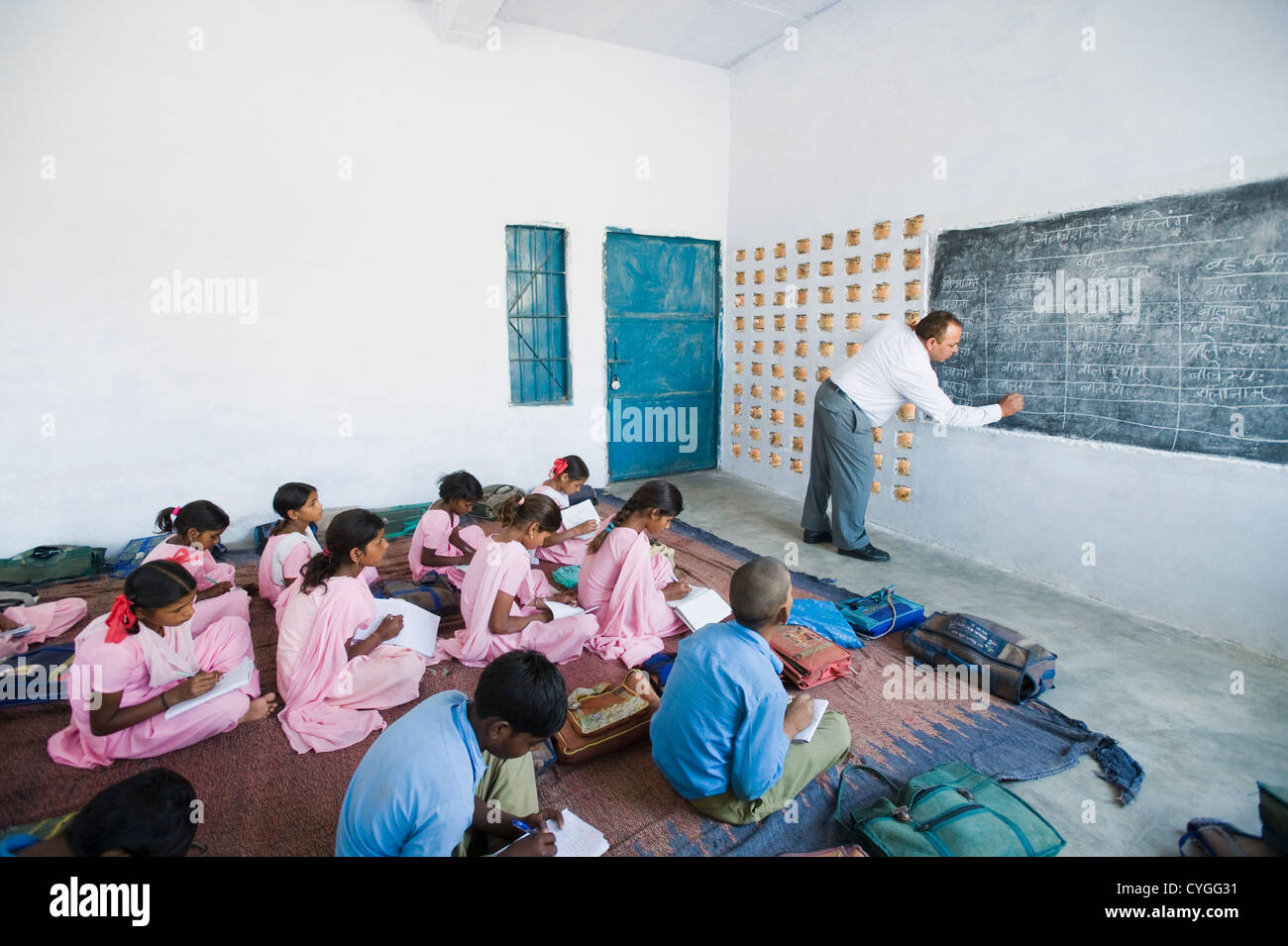 Rural indian village school teacher hi-res stock photography and images ...