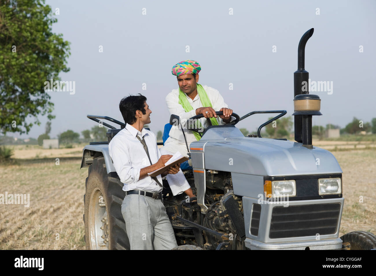 Financial advisor explaining to a farmer about agriculture loan Stock ...