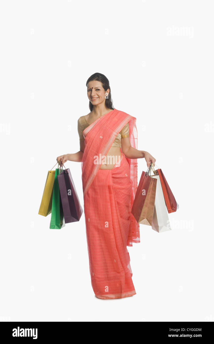 Smiling woman carrying paper Cut Out Stock Images & Pictures - Alamy