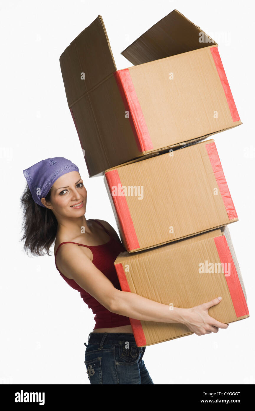 Woman carrying stack of cardboard boxes hi-res stock photography and ...