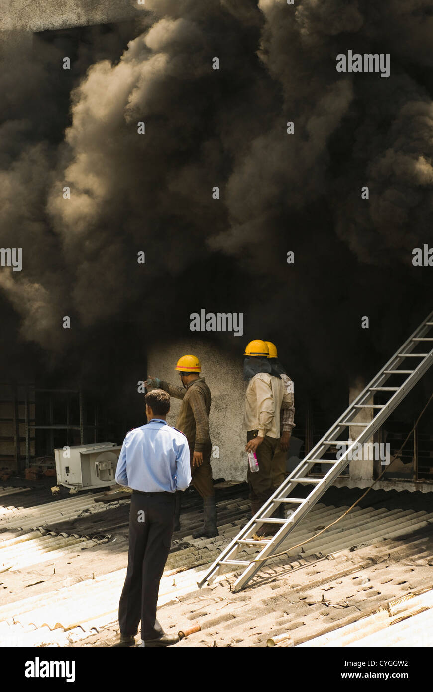 Firefighters during a rescue operation, Gurgaon, Haryana, India Stock ...