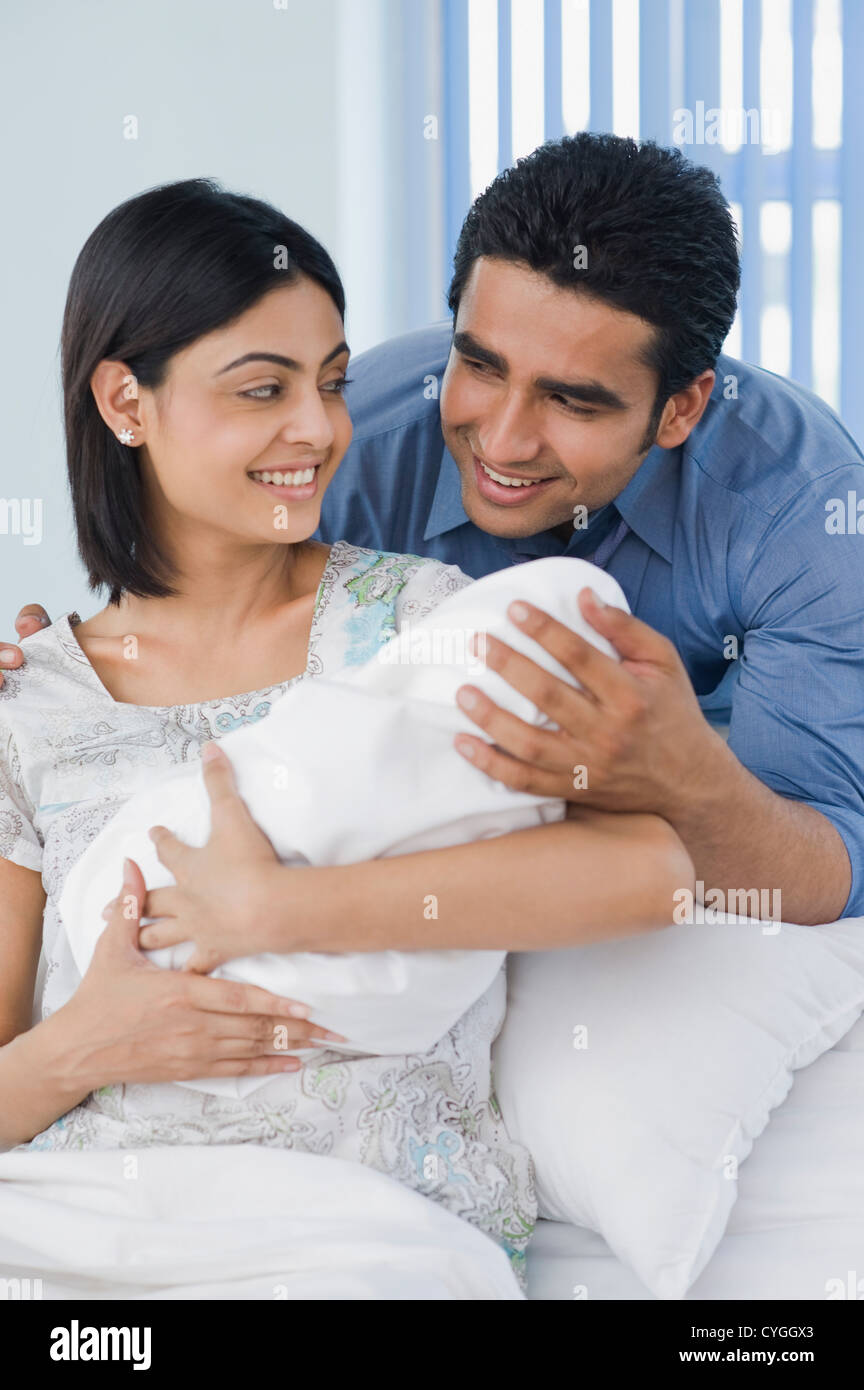 Parents with their newborn baby in a hospital Stock Photo - Alamy