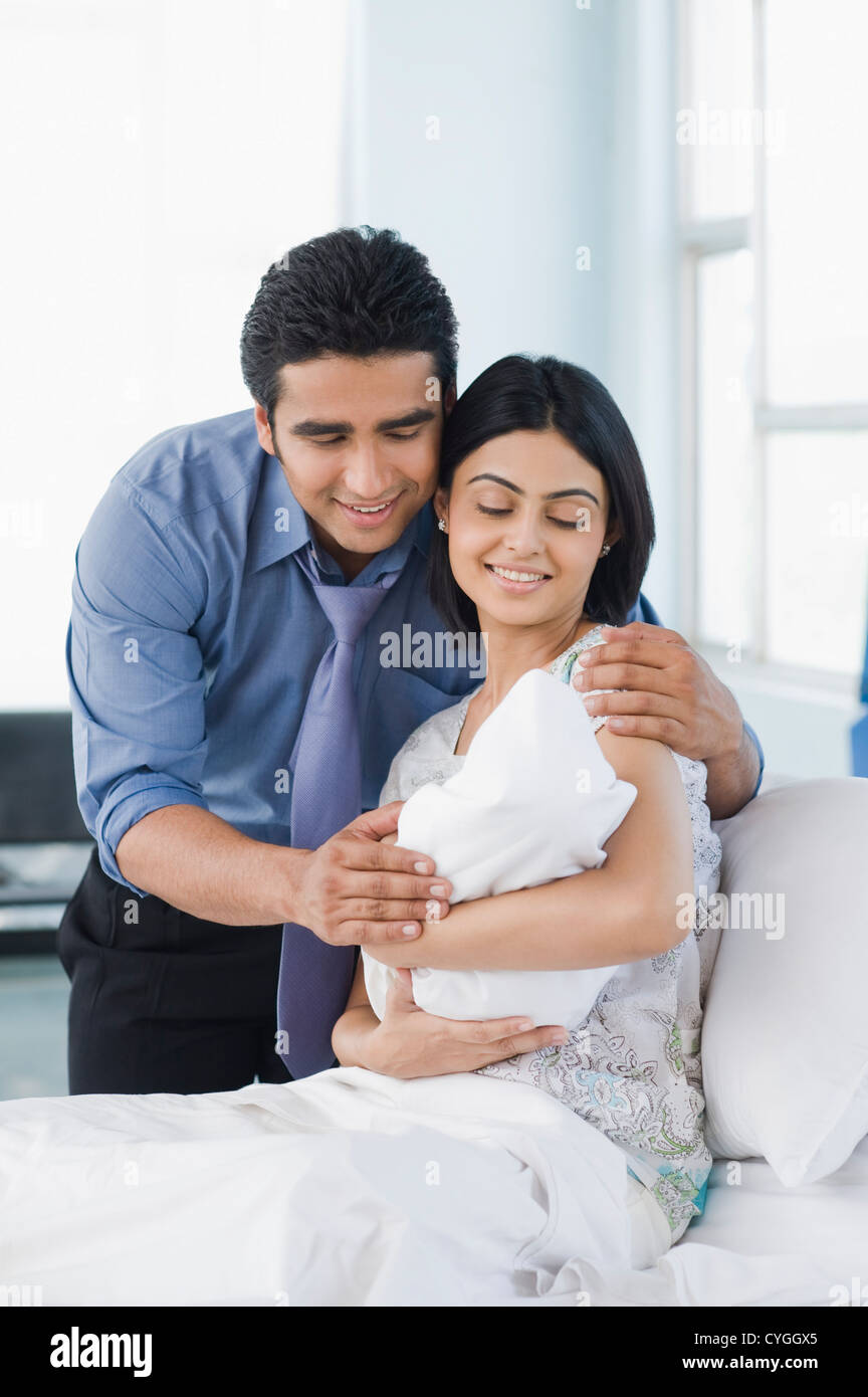 Parents with their newborn baby in a hospital Stock Photo - Alamy