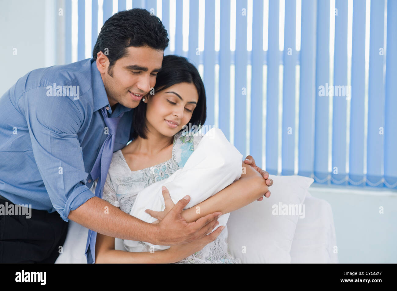 Parents with their newborn baby in a hospital Stock Photo - Alamy