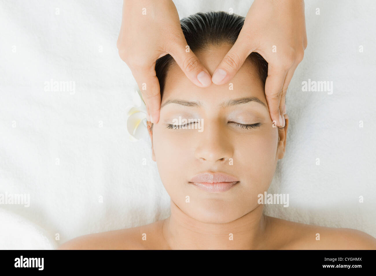 Woman receiving head massage at a spa Stock Photo - Alamy